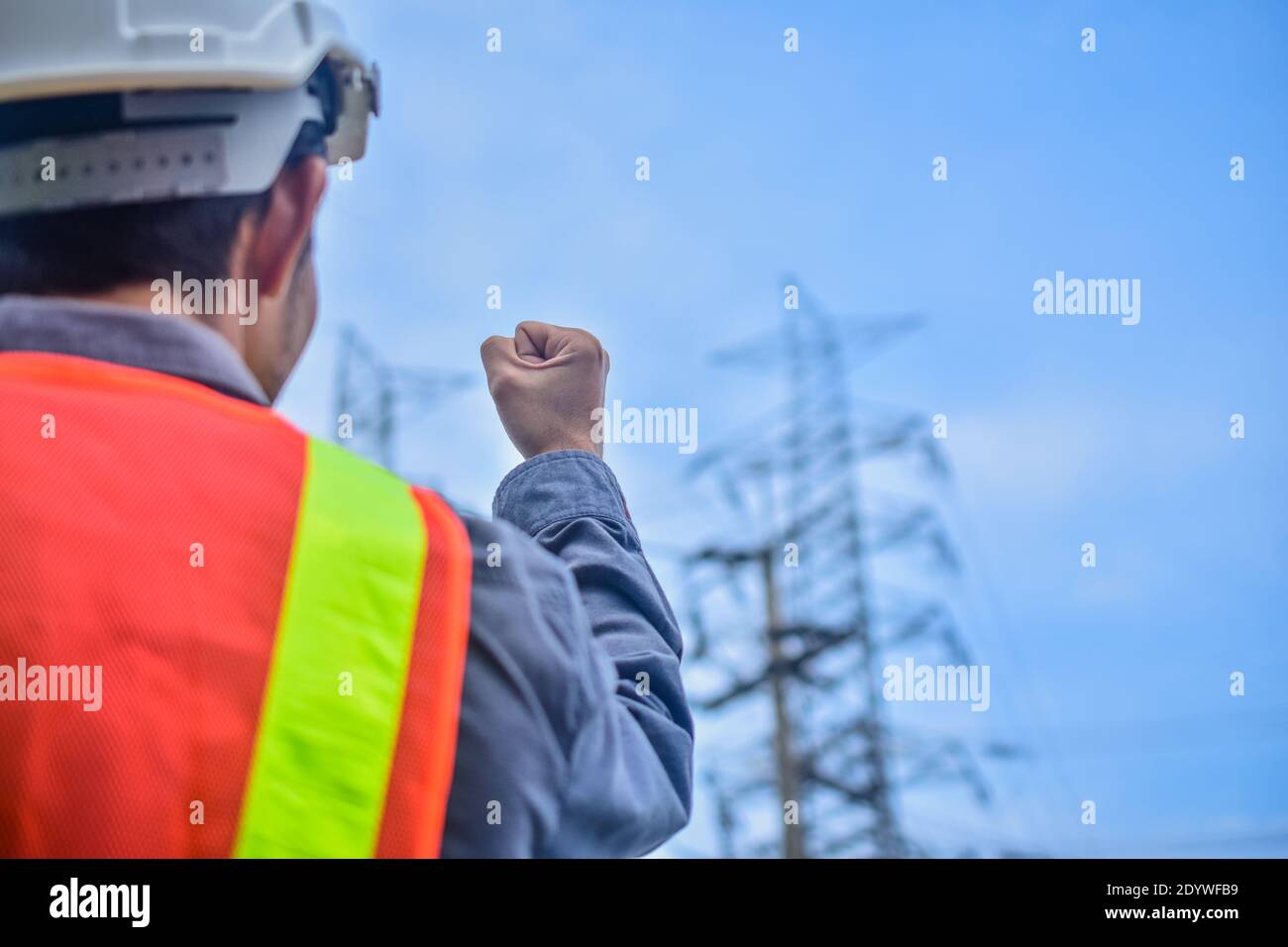 Engineer holding hand success at work Stock Photo - Alamy