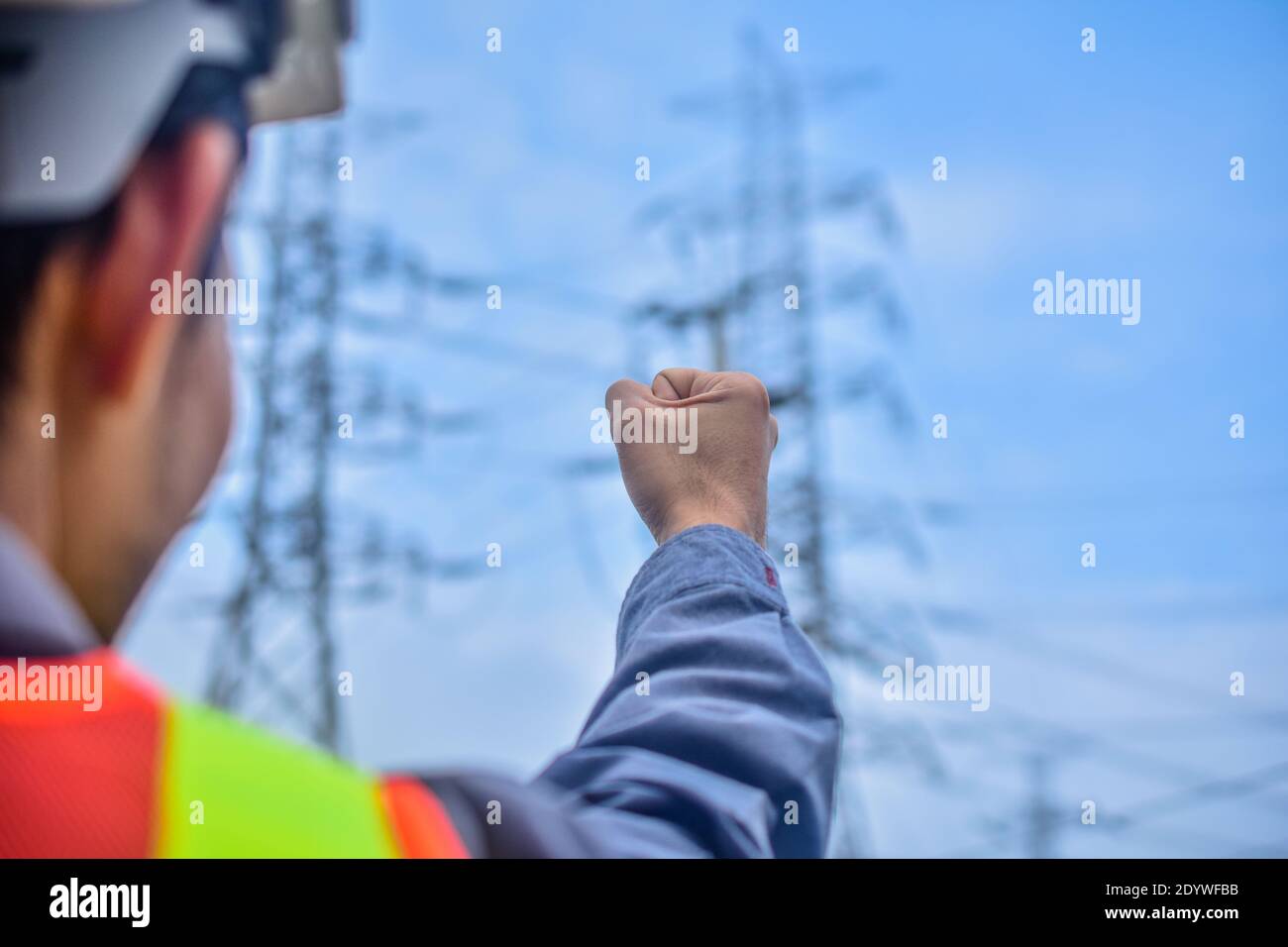 Engineer holding hand success at work Stock Photo - Alamy
