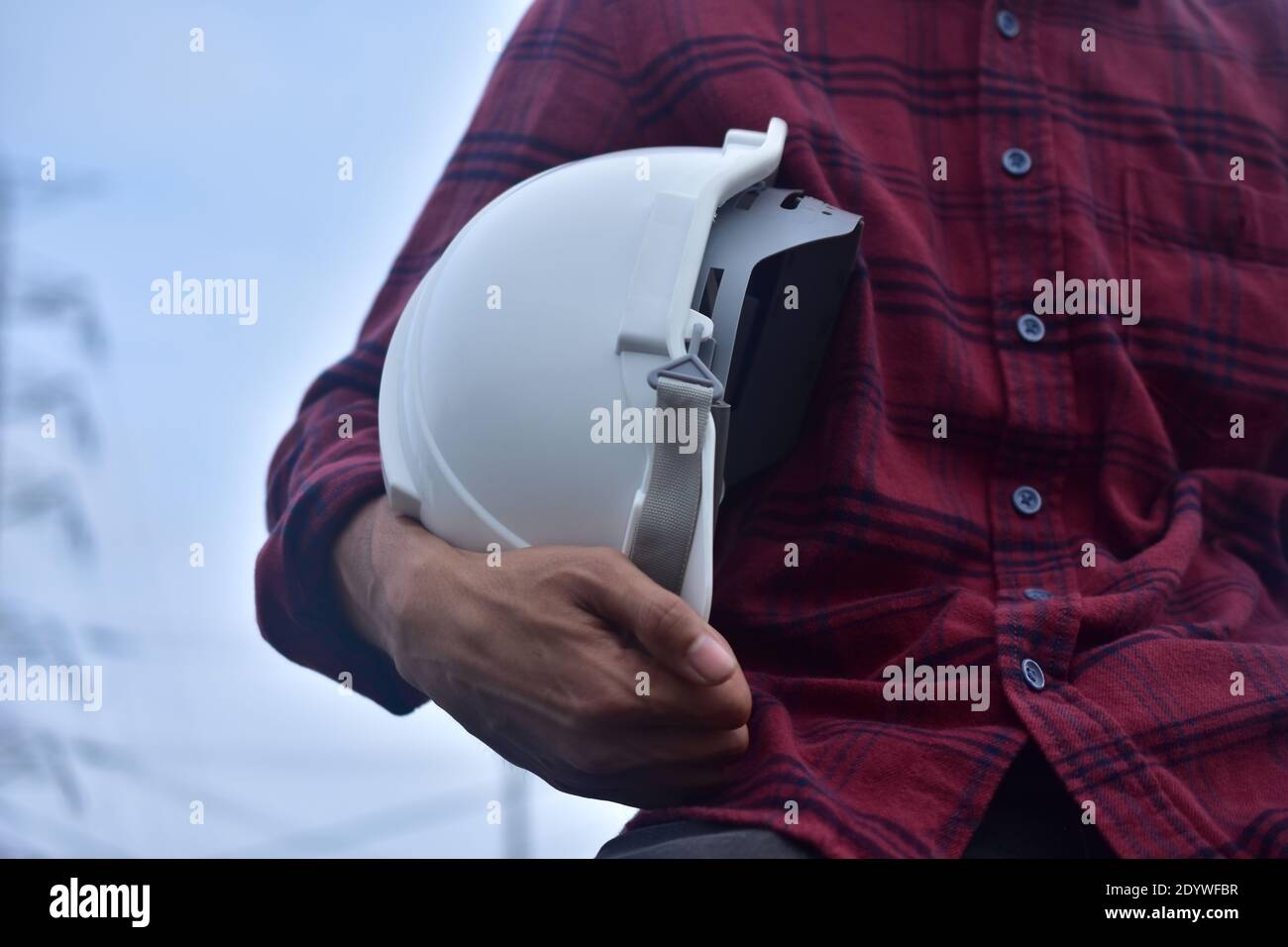 Close up Engineer holding hard hat safety at work place Stock Photo - Alamy