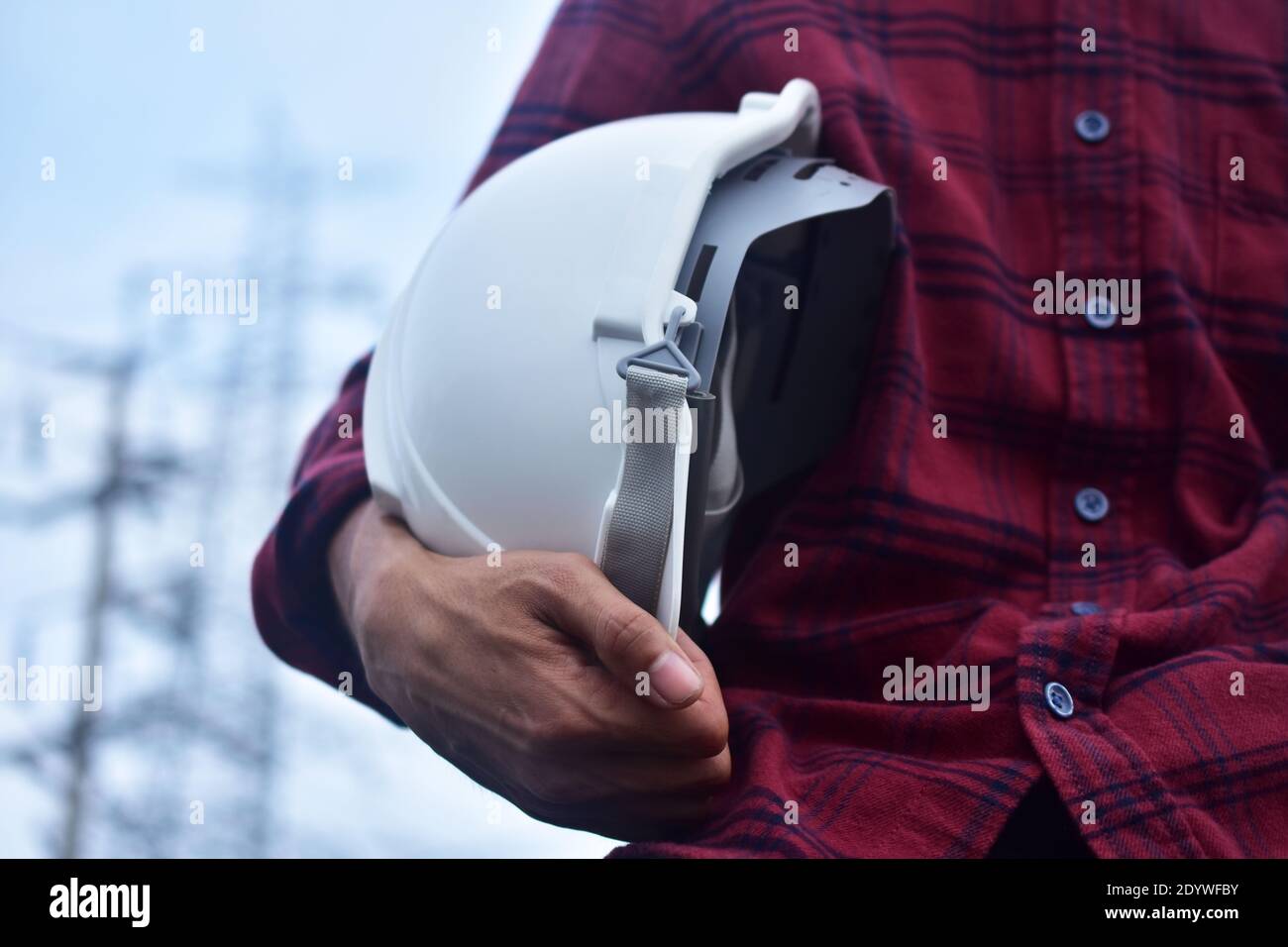 Close up Engineer holding hard hat safety at work place Stock Photo - Alamy