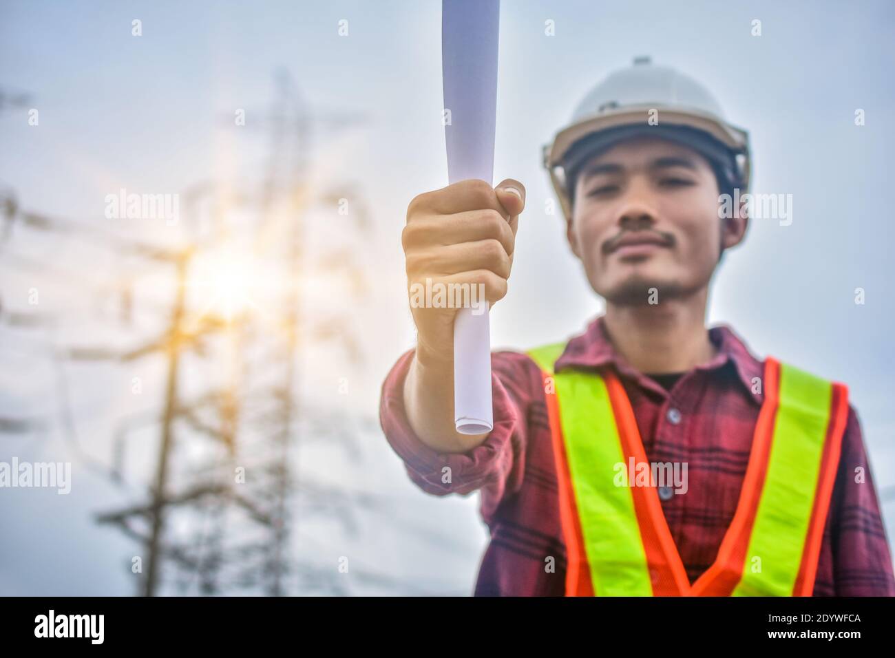 Close up hand holding paper,Engineer holding paper plan for using at ...