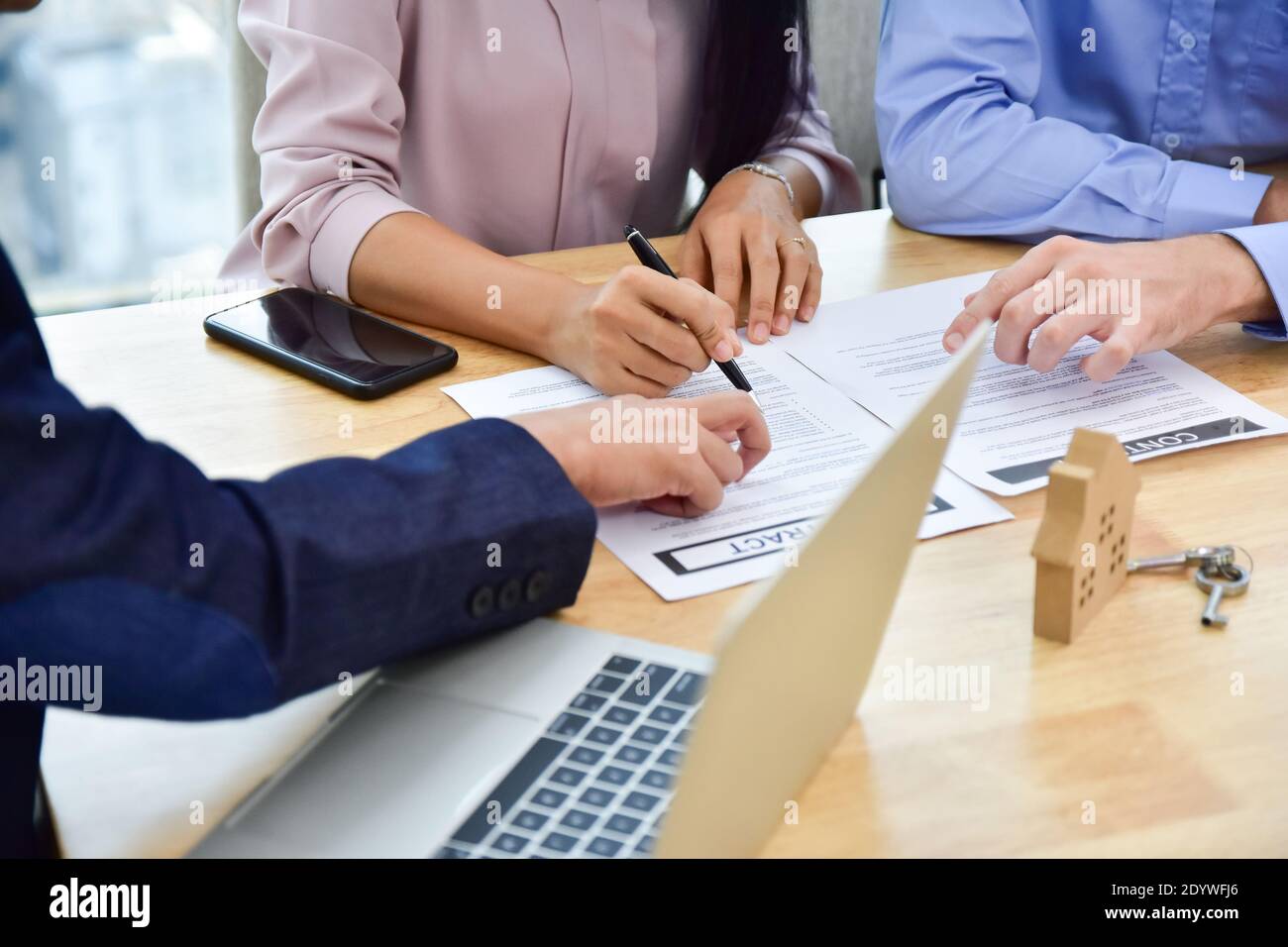 Close up People are signing house purchase contracts Stock Photo - Alamy