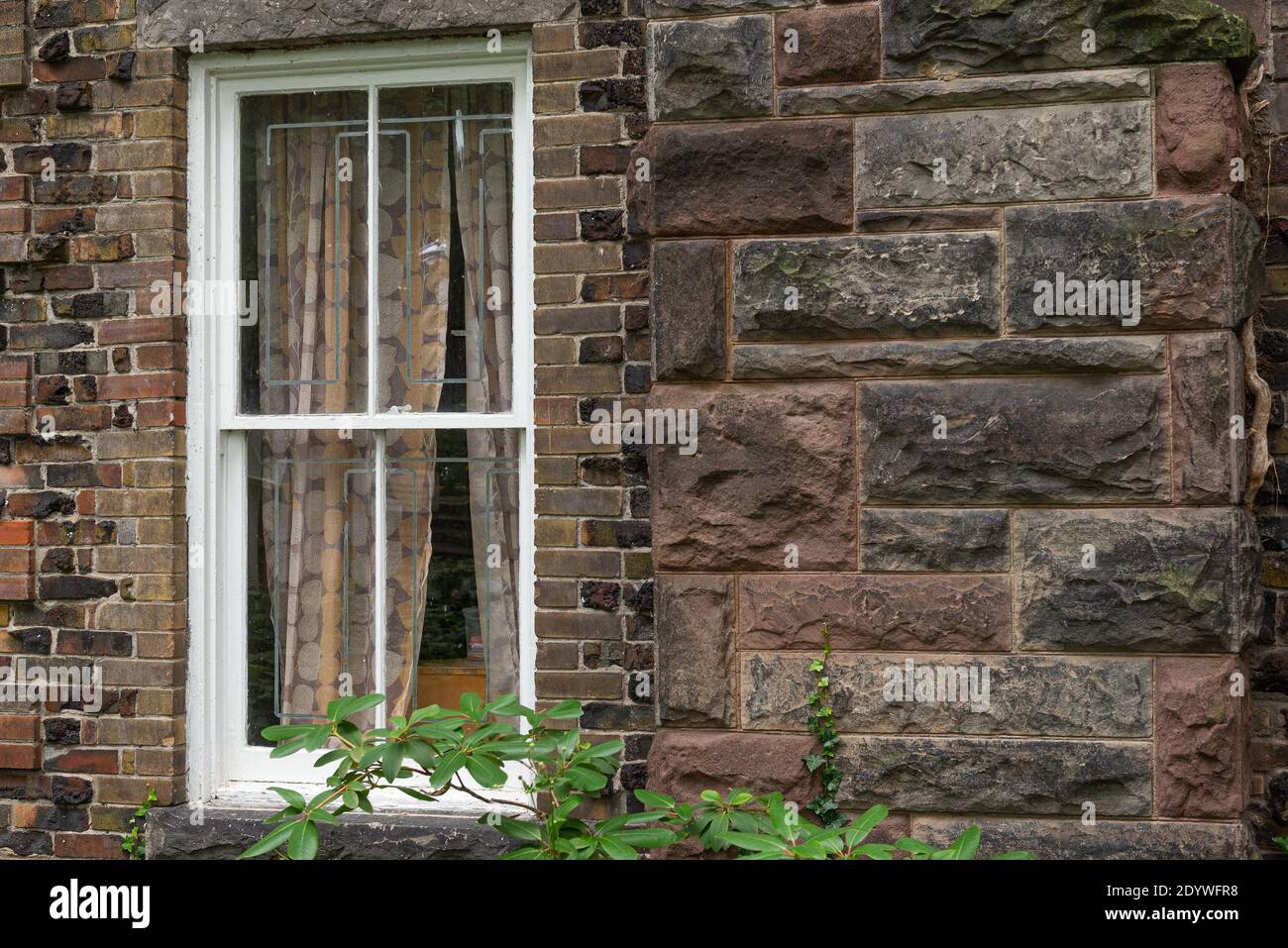 View at white window in brown blocks wall Stock Photo - Alamy