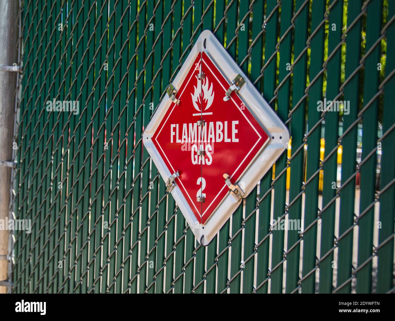 A red and white Flammable Gas warning sign on a fence Stock Photo - Alamy
