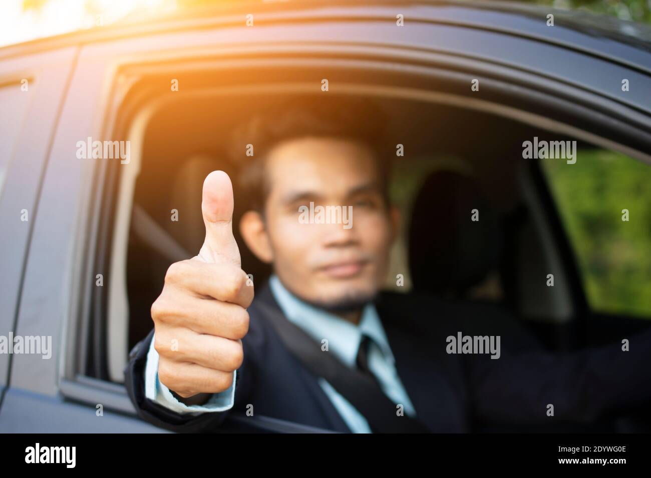 Man holding hand success at car Stock Photo - Alamy
