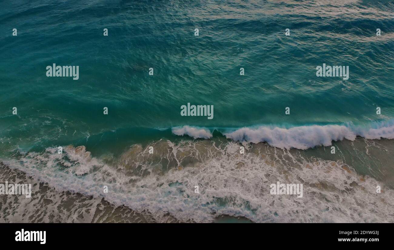 Aerial panorama of beautiful beach of turquoise ocean water at waves ...
