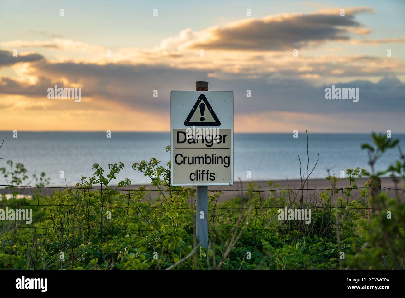 Sign: Danger, crumbling cliffs, seen in Hunstanton, Norfolk, England ...