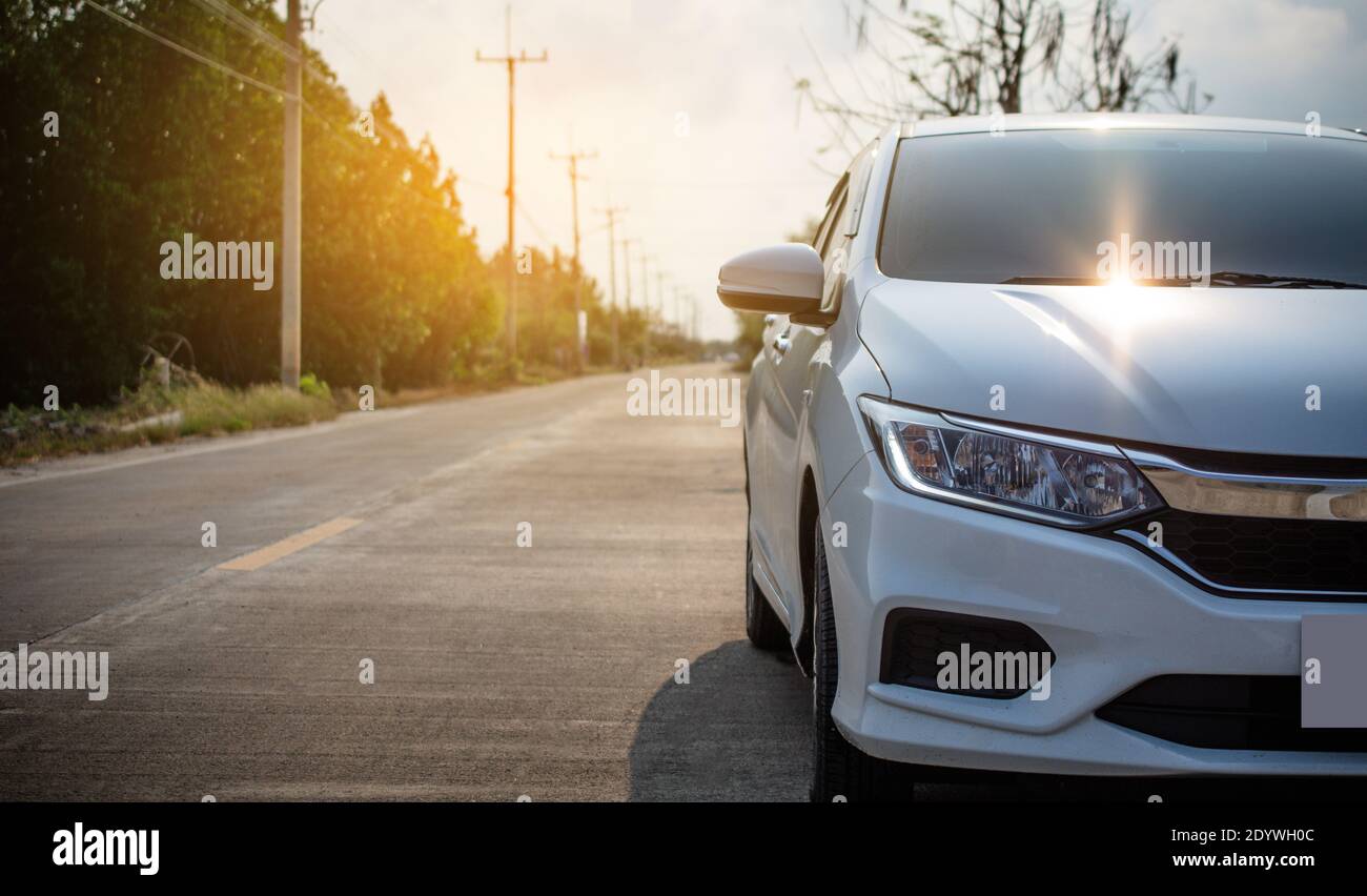 Close up front of car parked on the asphalt road Stock Photo - Alamy