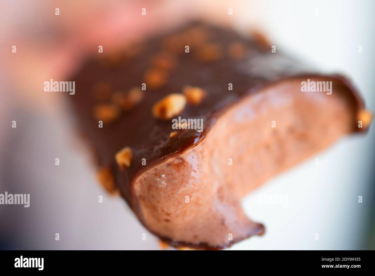People eating chocolate-coated popsicle Stock Photo - Alamy