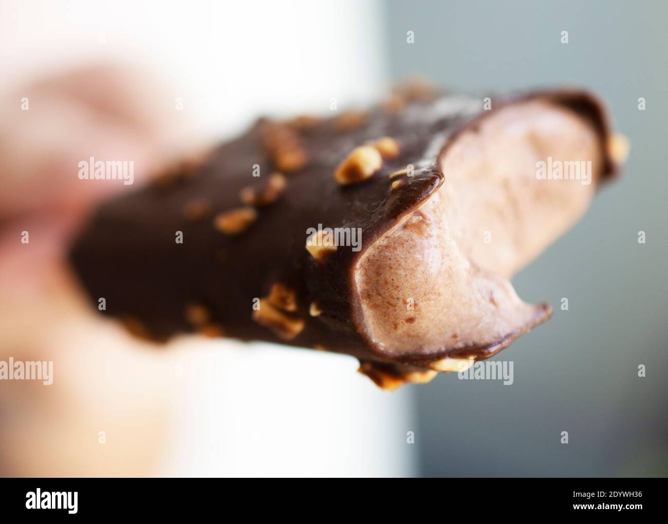 People eating chocolate-coated popsicle Stock Photo - Alamy