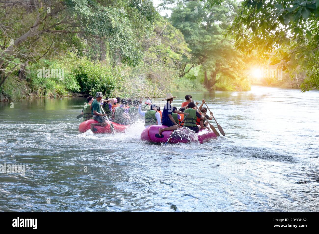 People are surfing mid-rafting, rafting in the rapids Stock Photo - Alamy