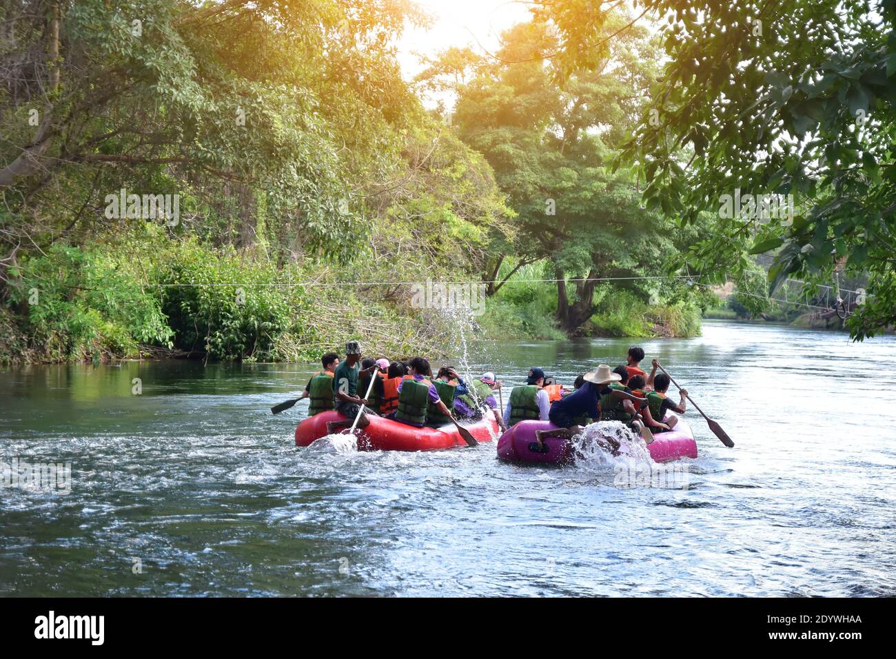 People are surfing mid-rafting, rafting in the rapids Stock Photo - Alamy