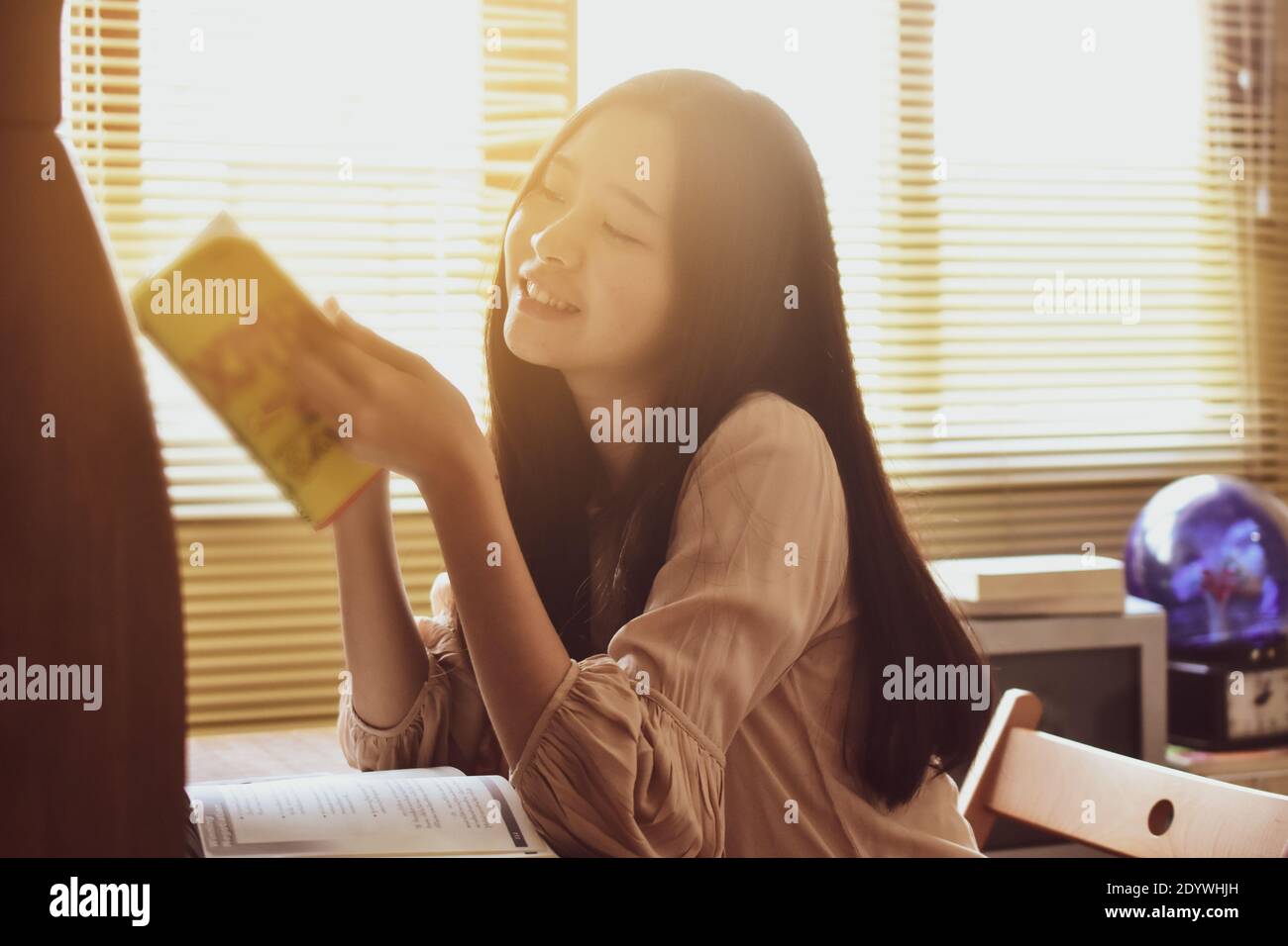 Blurry subject women reading in room Stock Photo - Alamy
