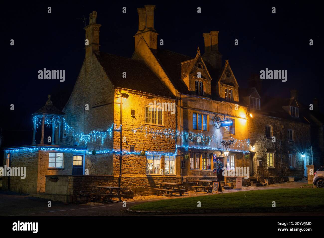 Christmas decorations and lights outside the Bell inn at night ...