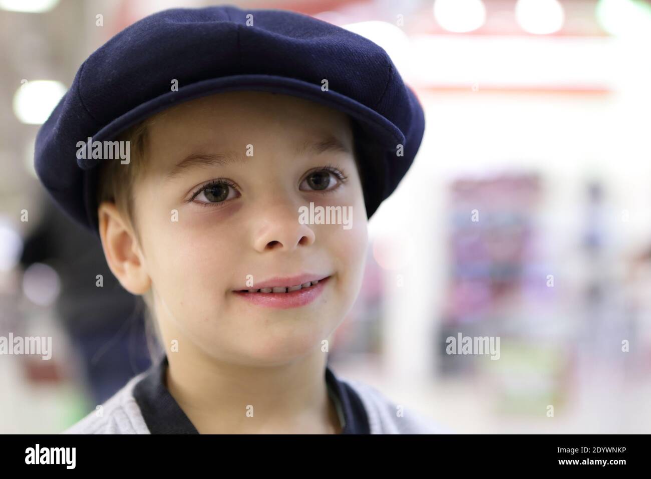 Portrait of a boy in large cap Stock Photo - Alamy
