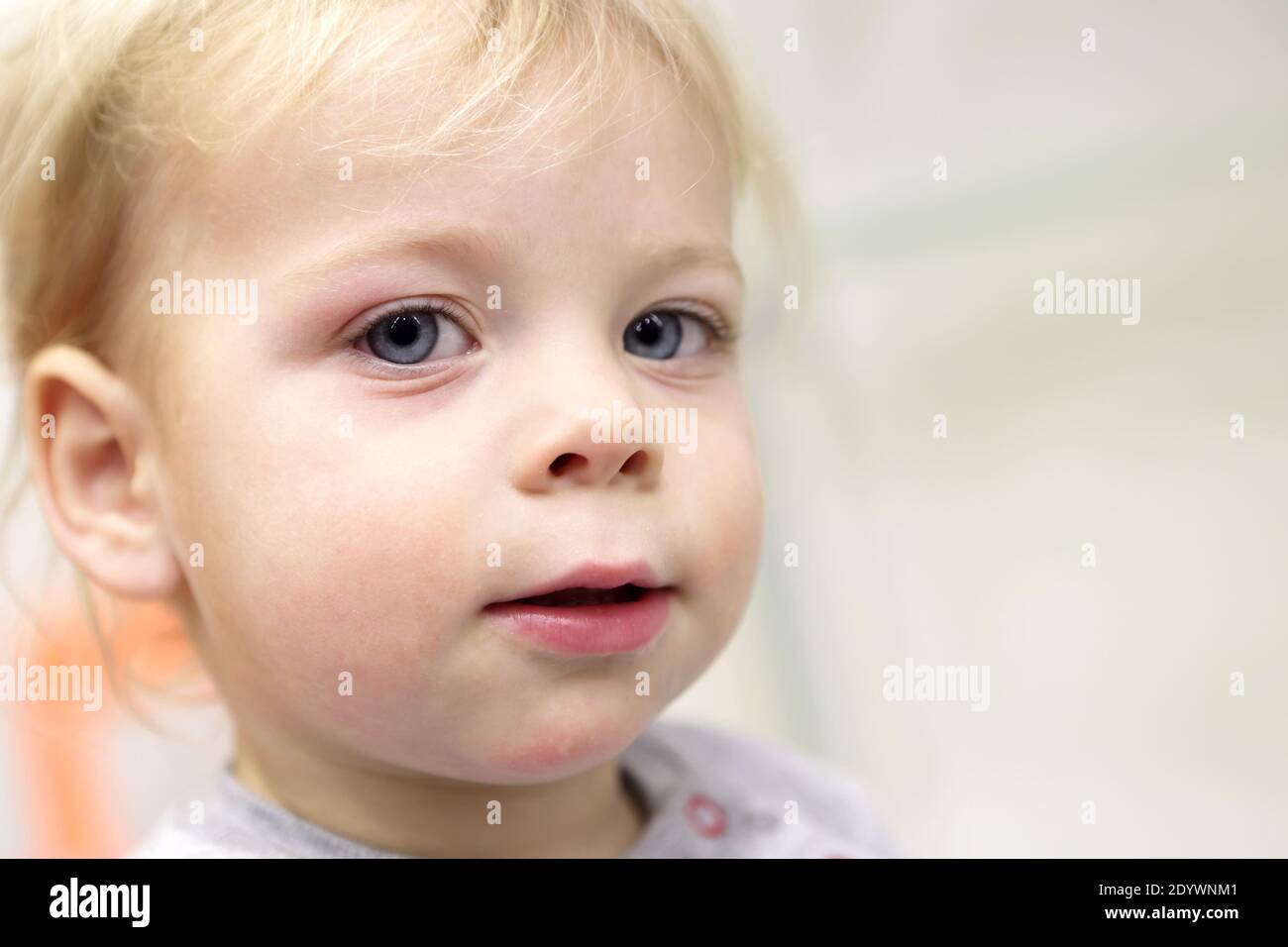 Face of a thinking toddler at home Stock Photo - Alamy