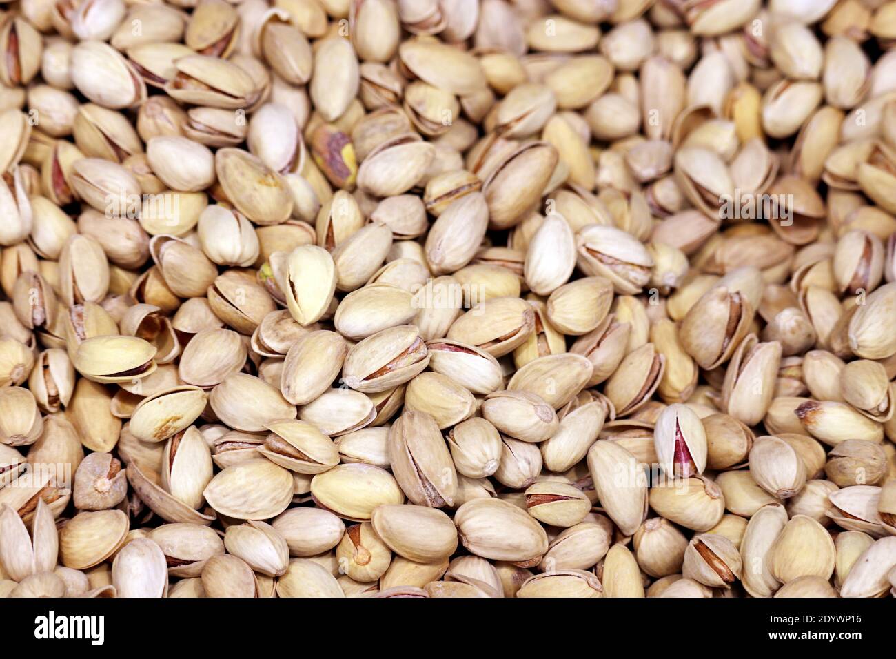 Pistachio nuts, selective focus. Roasted and salted pistachios in shells on the market Stock ...