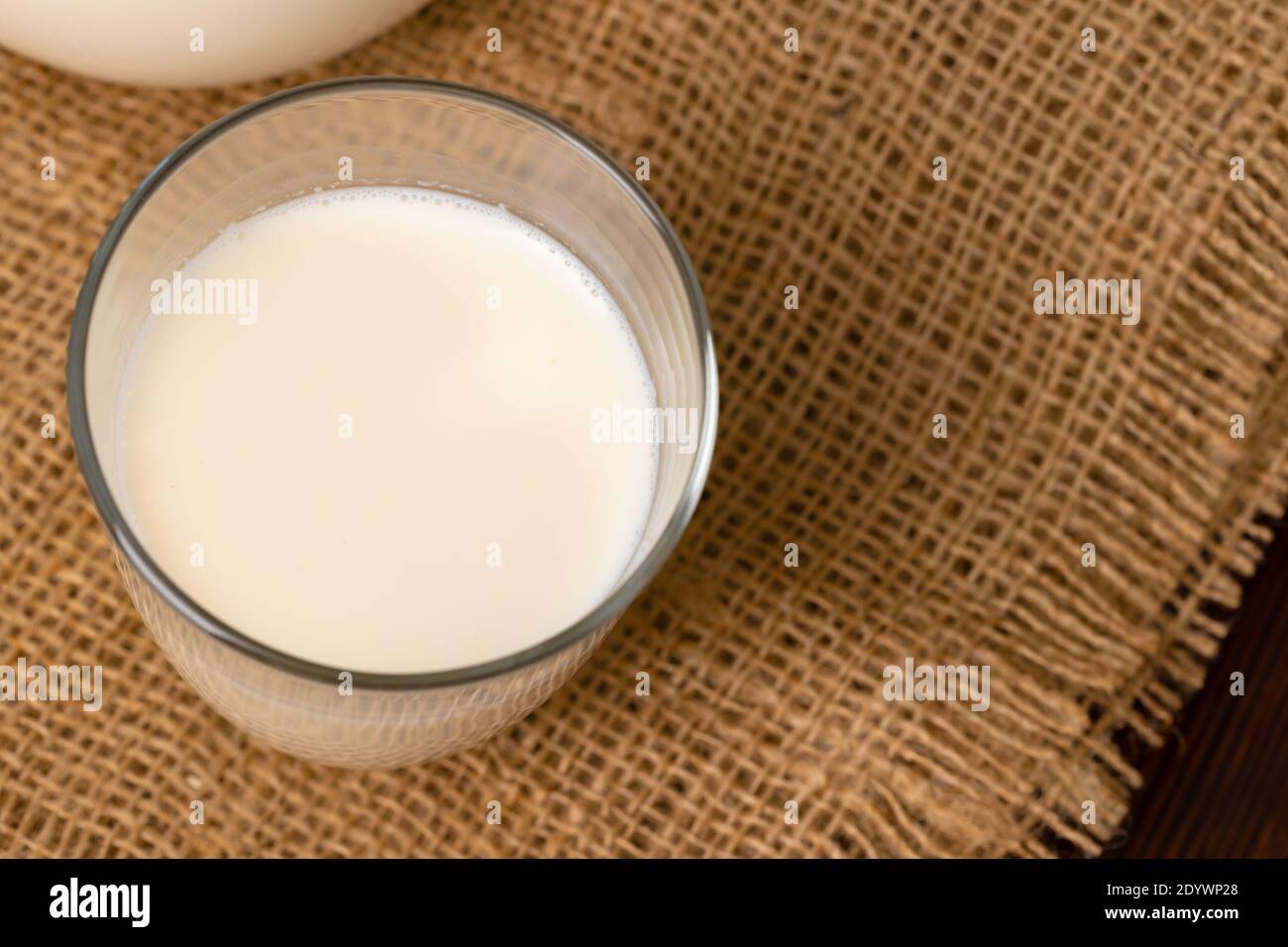 Glass cup of milk on table close up Stock Photo - Alamy