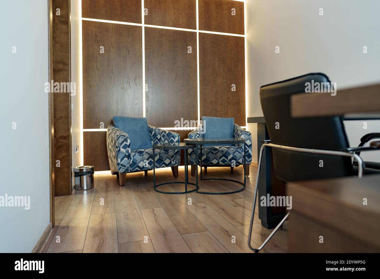Office waiting area with arm chairs and coffee table Stock Photo - Alamy