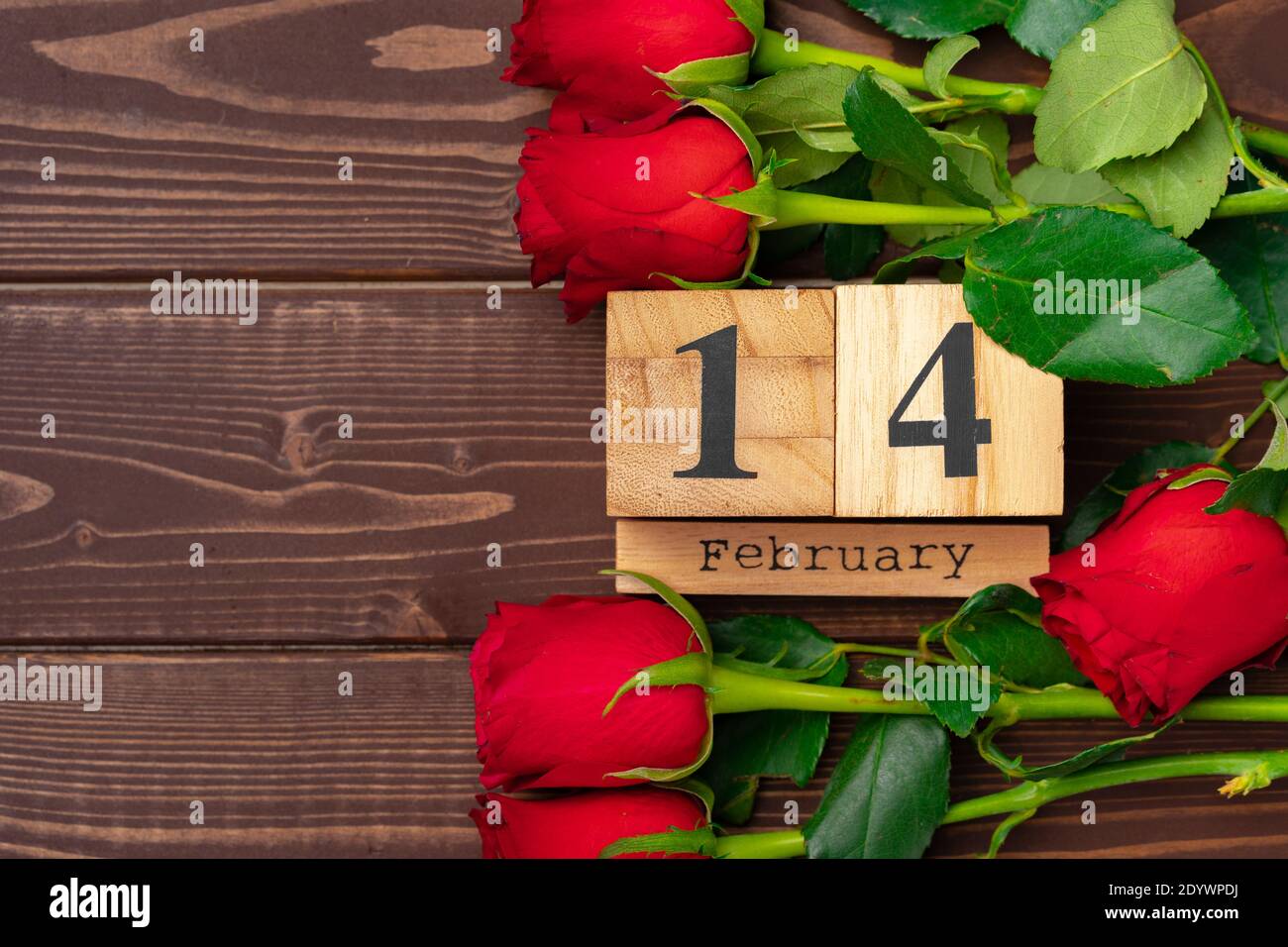 Wooden calendar and roses on brown wooden background Stock Photo - Alamy
