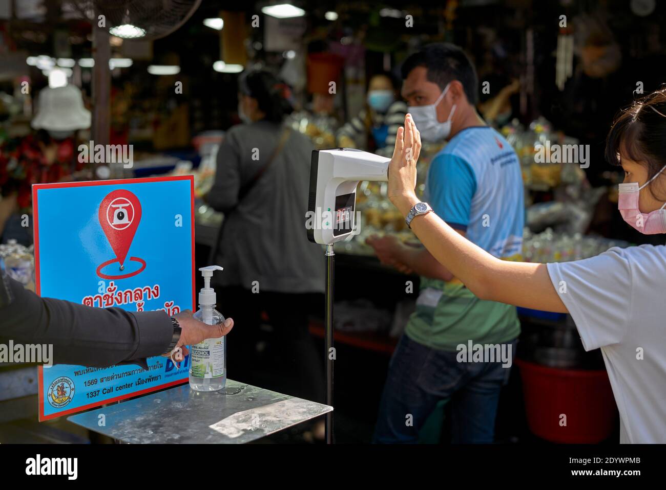 Covid-19 temperature check with non contact thermometer and hand ...