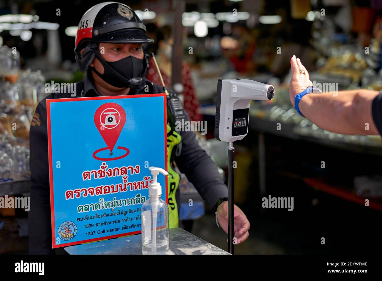 Covid-19 temperature check with non contact thermometer and hand ...