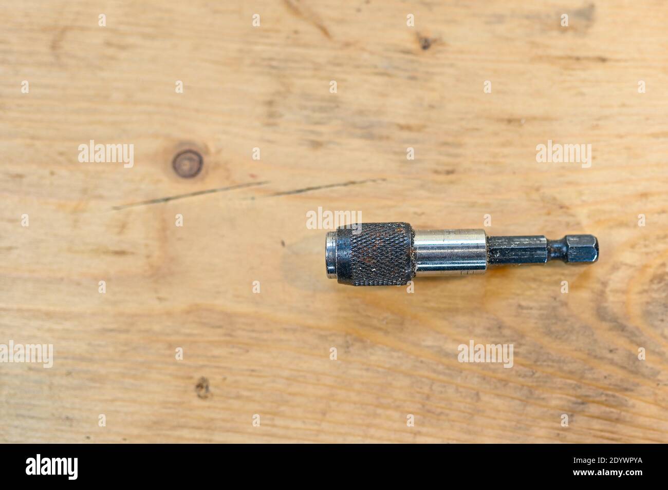 rusty old bit holder on wooden bench Stock Photo - Alamy