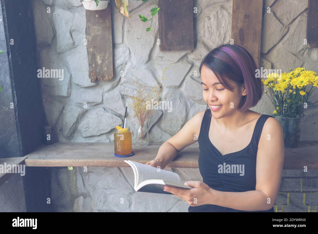 Happy girl reading good books Stock Photo - Alamy