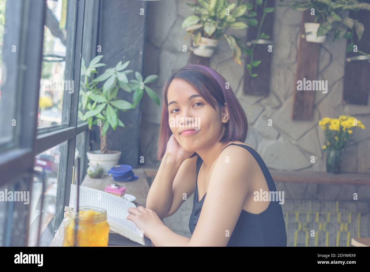 Cute girl reading book Stock Photo - Alamy
