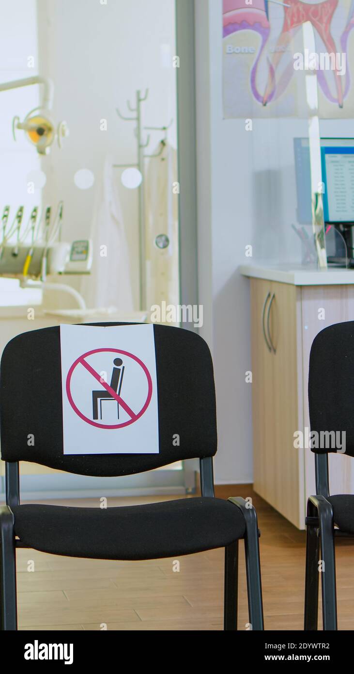 Dental clinic reception with nobody in it modern equipped with signs on ...
