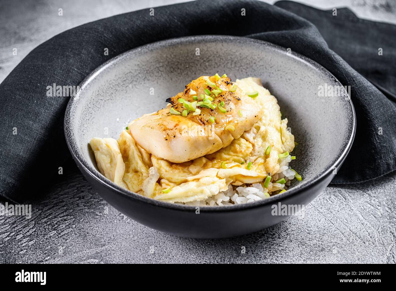 Steamed cod fillet with omelet and rice. White background. Top view ...