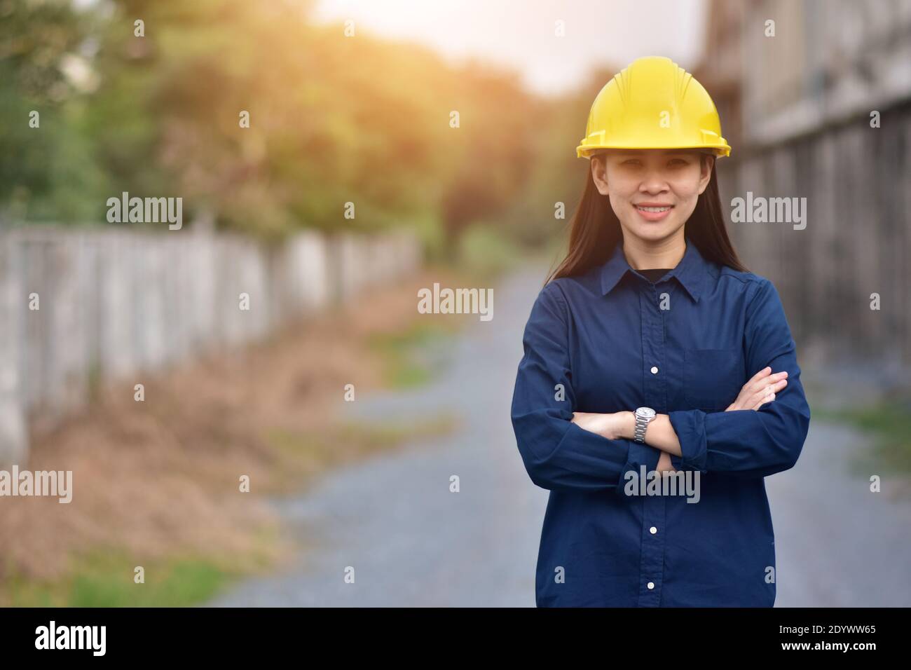 Woman Engineer Yellow hard hat safety Stock Photo - Alamy