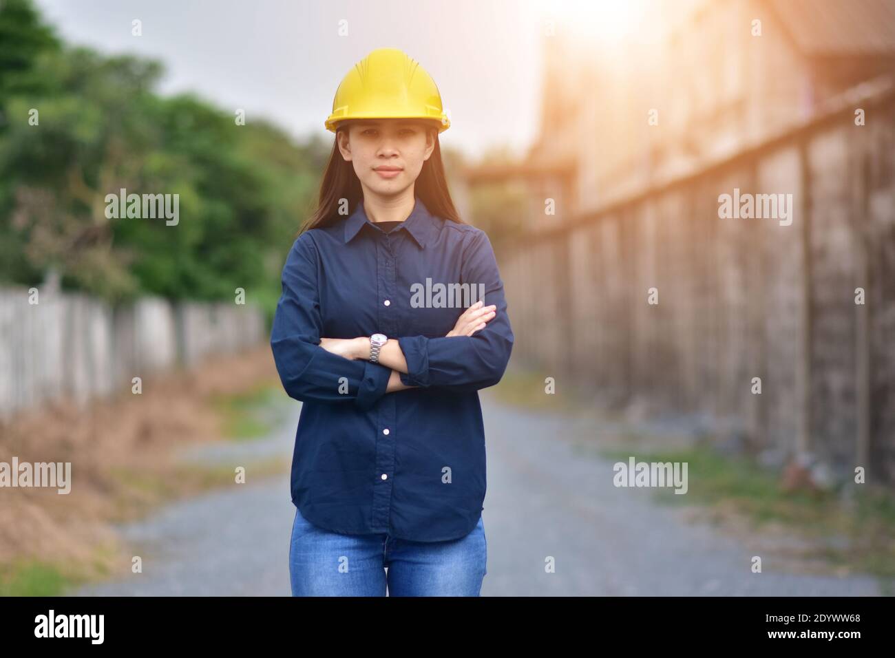 Woman Engineer Yellow hard hat safety Stock Photo - Alamy