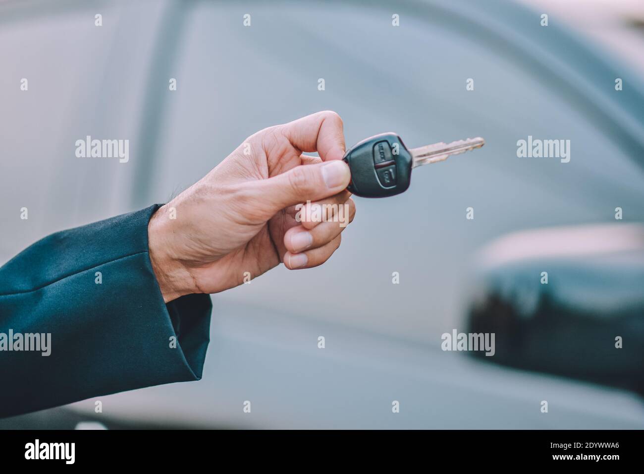 Car salesperson holding key hi-res stock photography and images - Alamy