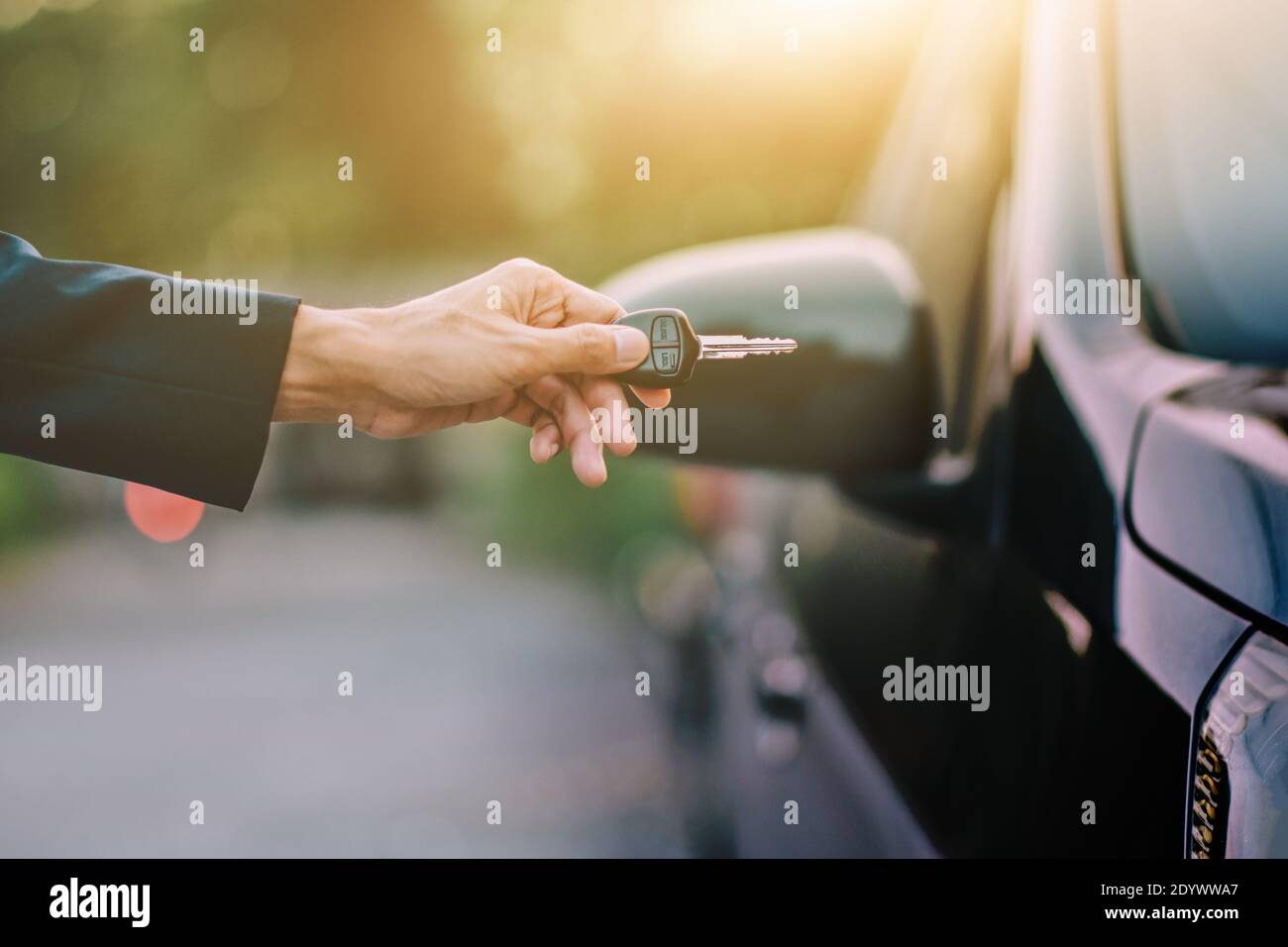 Car salesperson holding key hi-res stock photography and images - Alamy