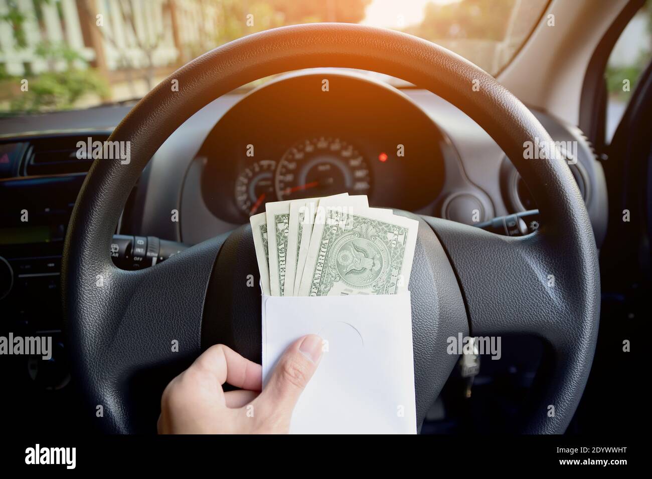 Car parked on street, Money in Car on road in morning Stock Photo - Alamy