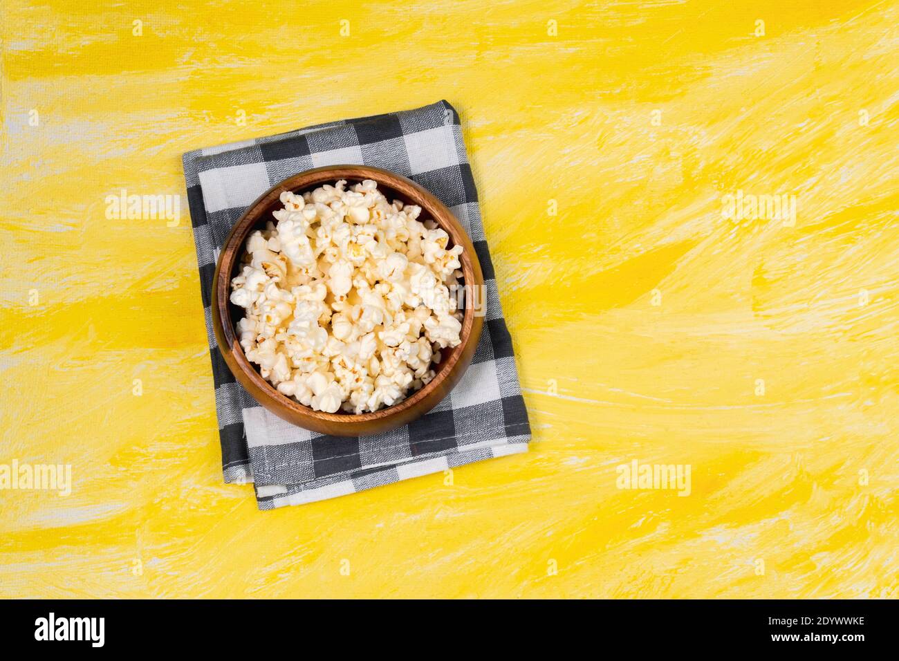 Popcorn on a yellow background. Film. Fast food. Corn. top view with ...