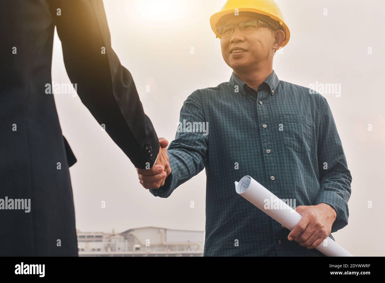 Engineer shake hands agreement construction project success Stock Photo ...