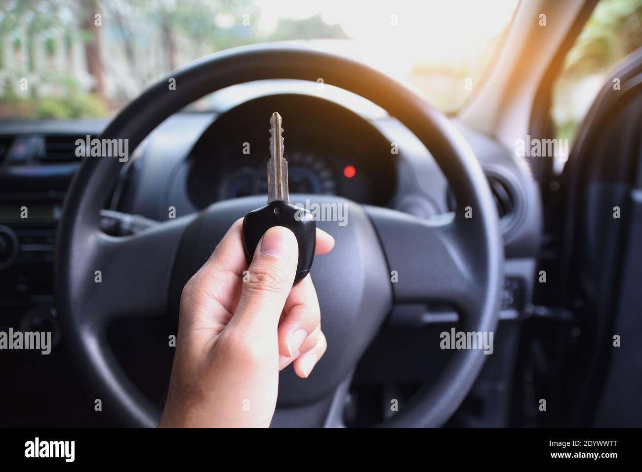 Key on hand in car for driving a car on road Stock Photo - Alamy