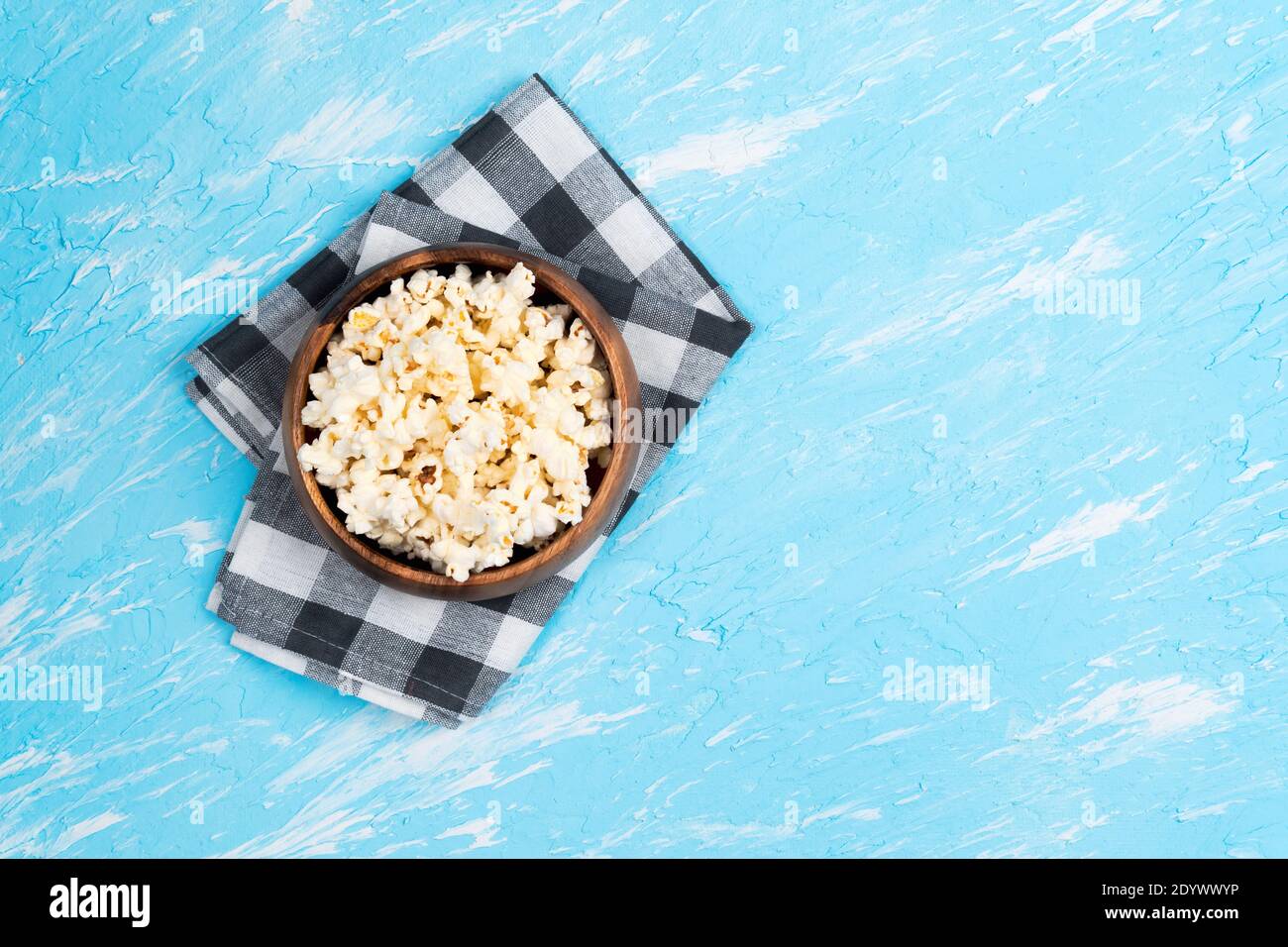 Popcorn. Flat lay a Cup of popcorn on a blue background. The view from ...