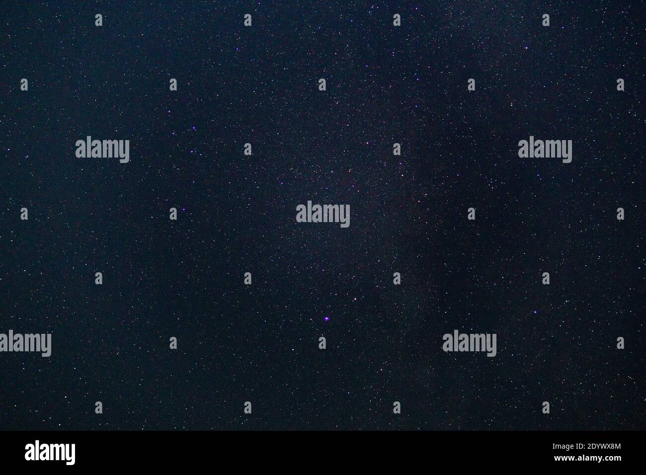 texture of the blue night sky and stars on a dark background. With ...