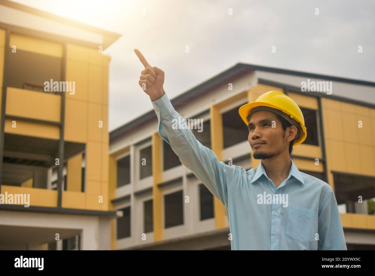 Project Engineer hard hat estate building construction site background ...