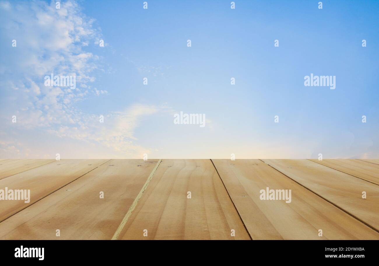 Wooden table and blue sky background montage for your texture concept ...