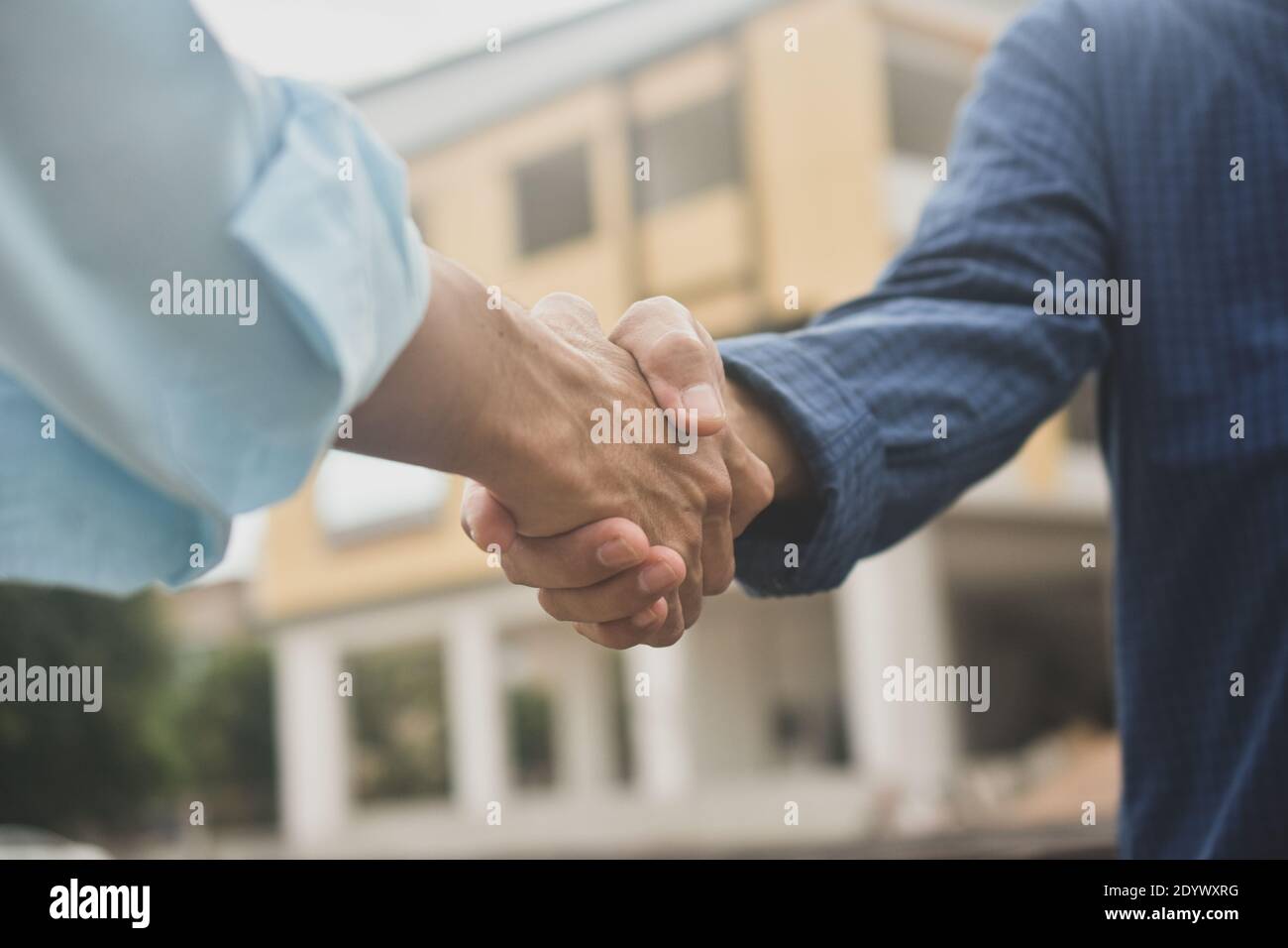 Contractor shake hand agreement success work at estate building ...