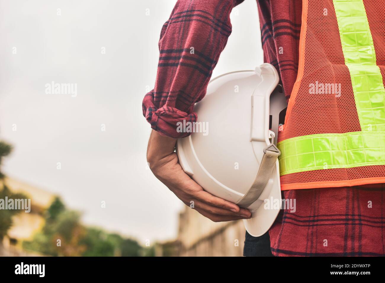 Engineer holding white helmet safety hard hat copy spec Stock Photo - Alamy