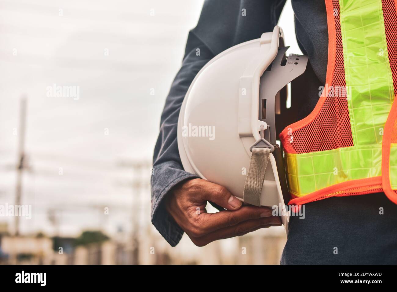 Engineer holding white helmet safety hard hat copy spec Stock Photo - Alamy