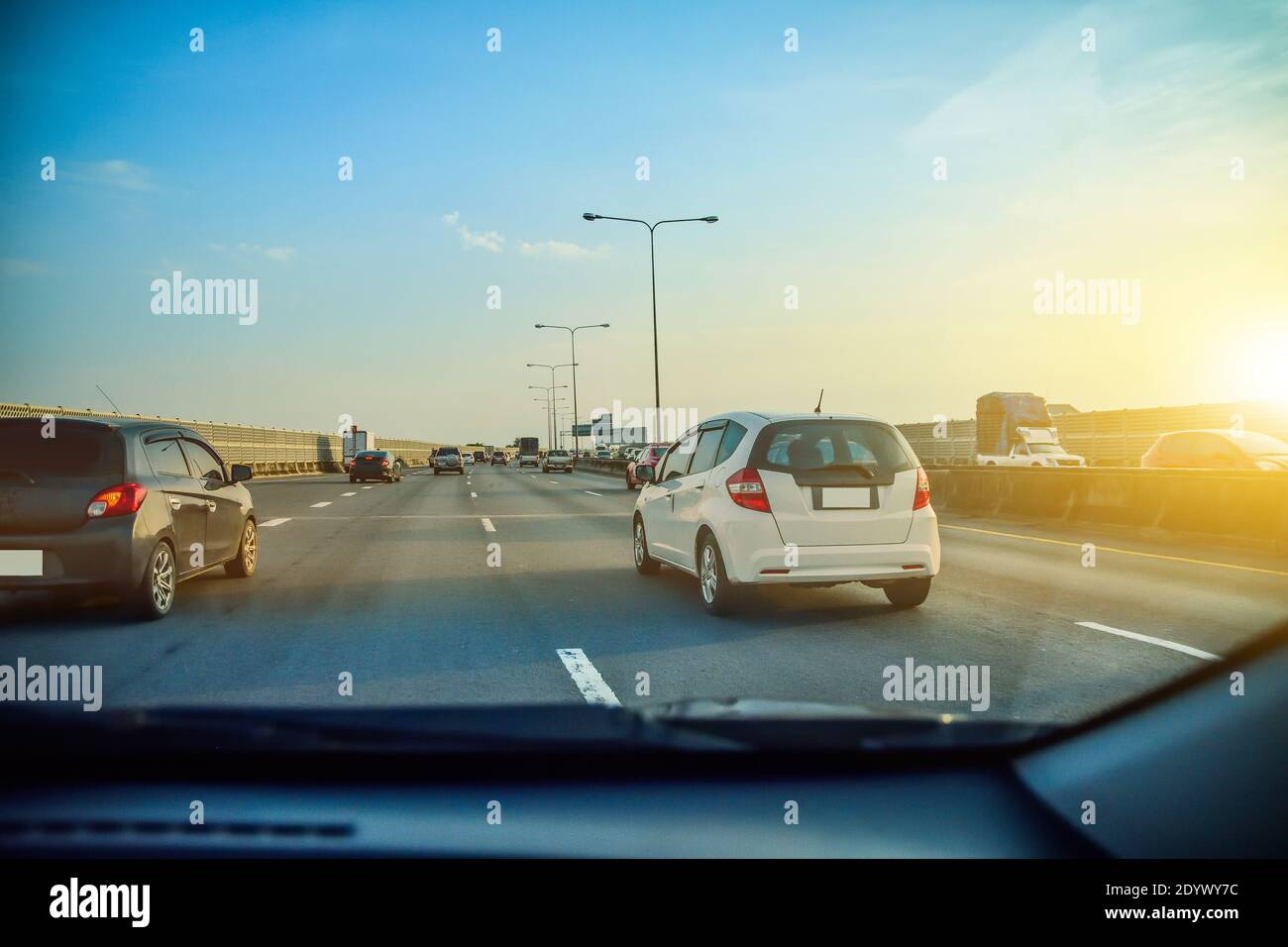 Car parked on road and car driving on high way road Stock Photo - Alamy