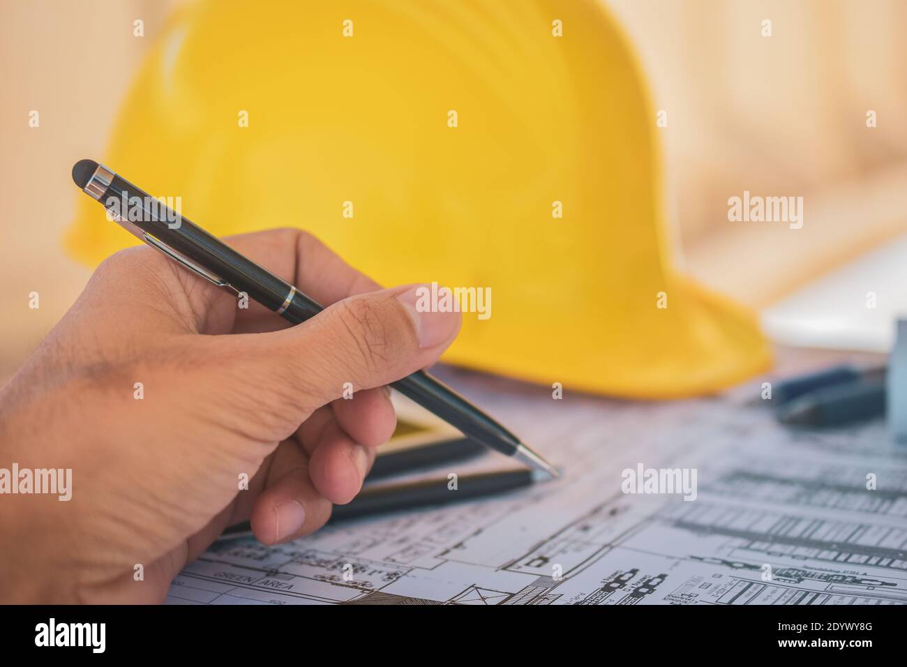 Close up hand writing on paperwork blueprint inspection plan ...