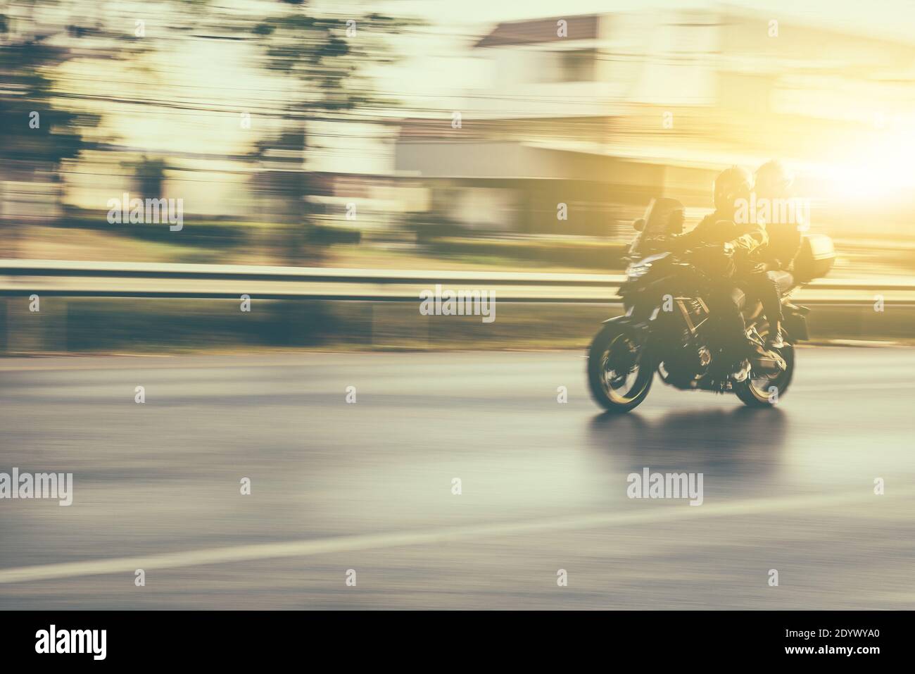 Blurry subject motorcycle driving on road Stock Photo - Alamy