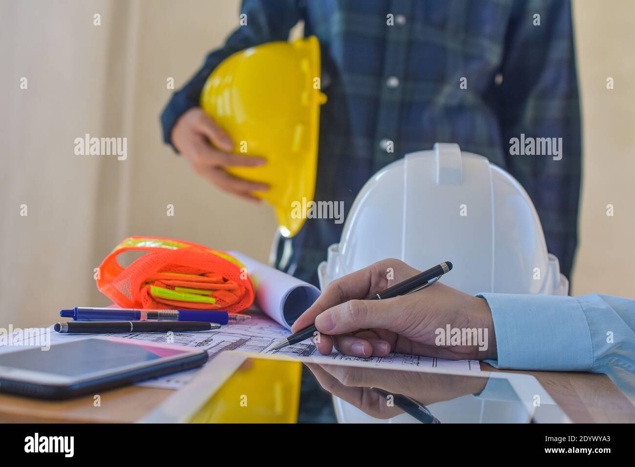 Close up hand writing on paperwork blueprint inspection plan ...